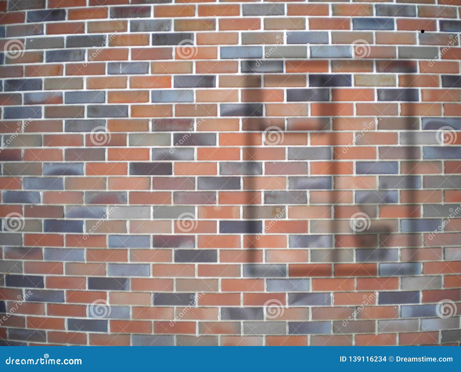 High Brick Wall with a Shadow in the Form of a Window on the Bricks ...