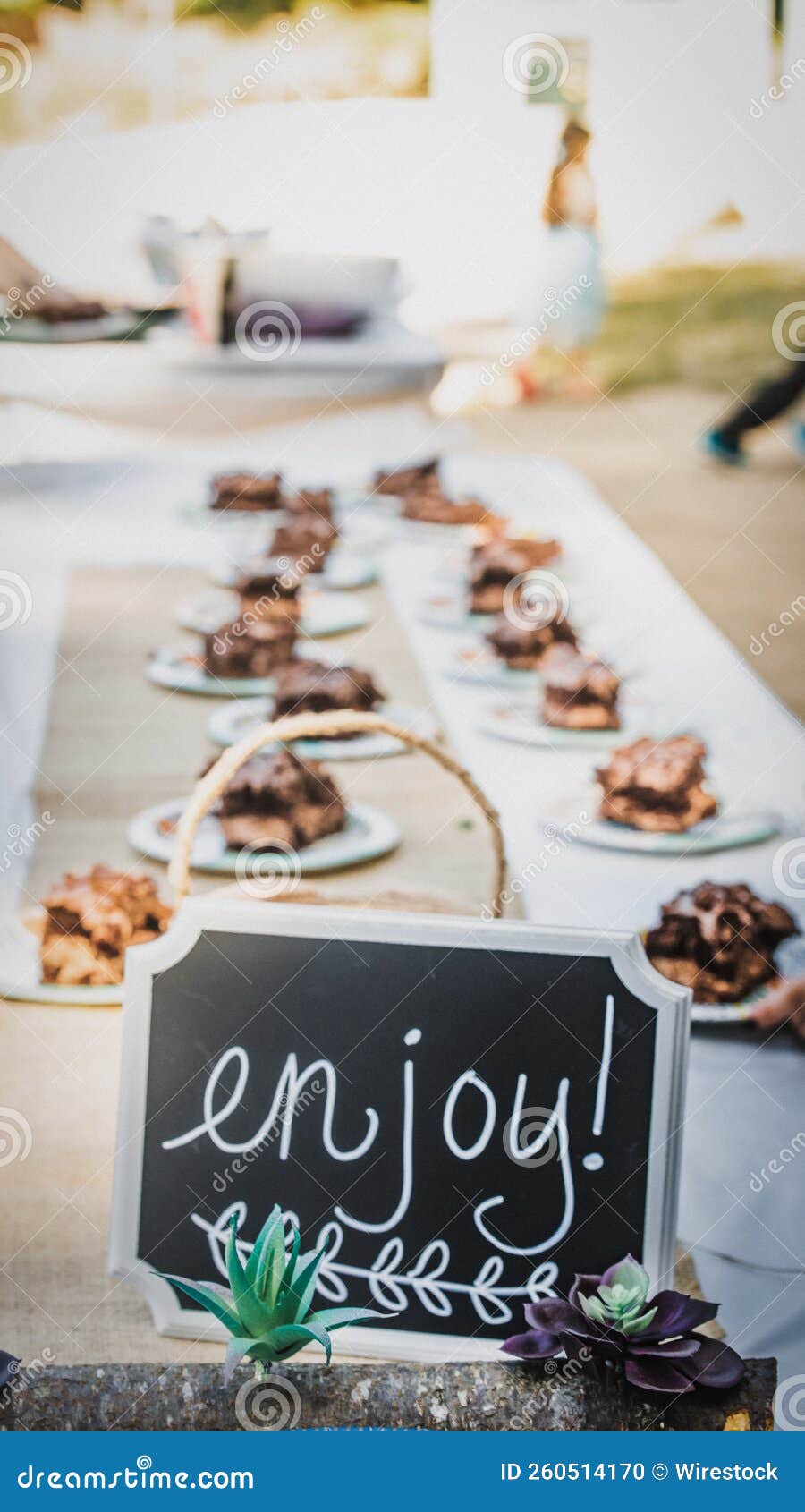 Vertical of a Wedding Reception Sign for Guests on a Table with Cake ...