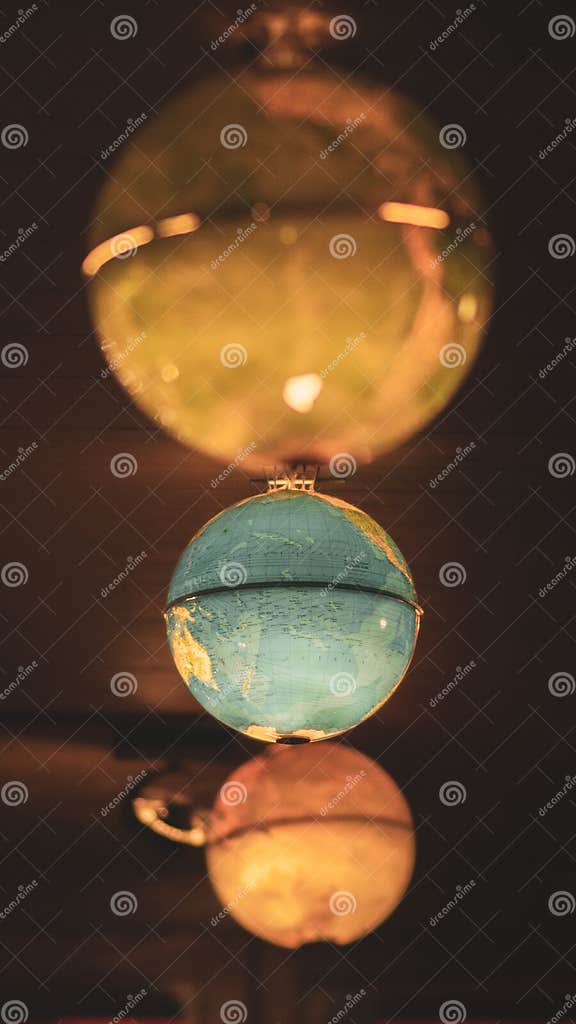 Vertical of a World Globes, Globuses Upside Down Stock Photo - Image of ...