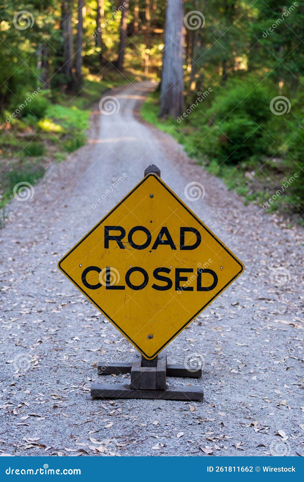 Vertical of Yellow Road Closed Sign in the Middle of a Road in the ...
