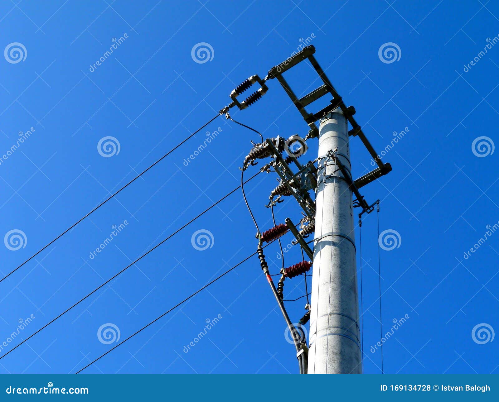 Vertically Dropping Electrical Cables Concrete Pole. Clear Blue Sky ...