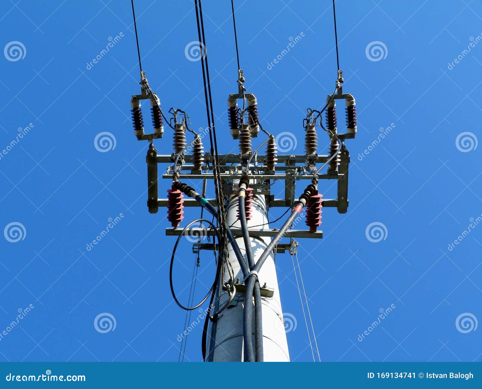 Vertically Dropping Electrical Cables Concrete Pole. Clear Blue Sky ...