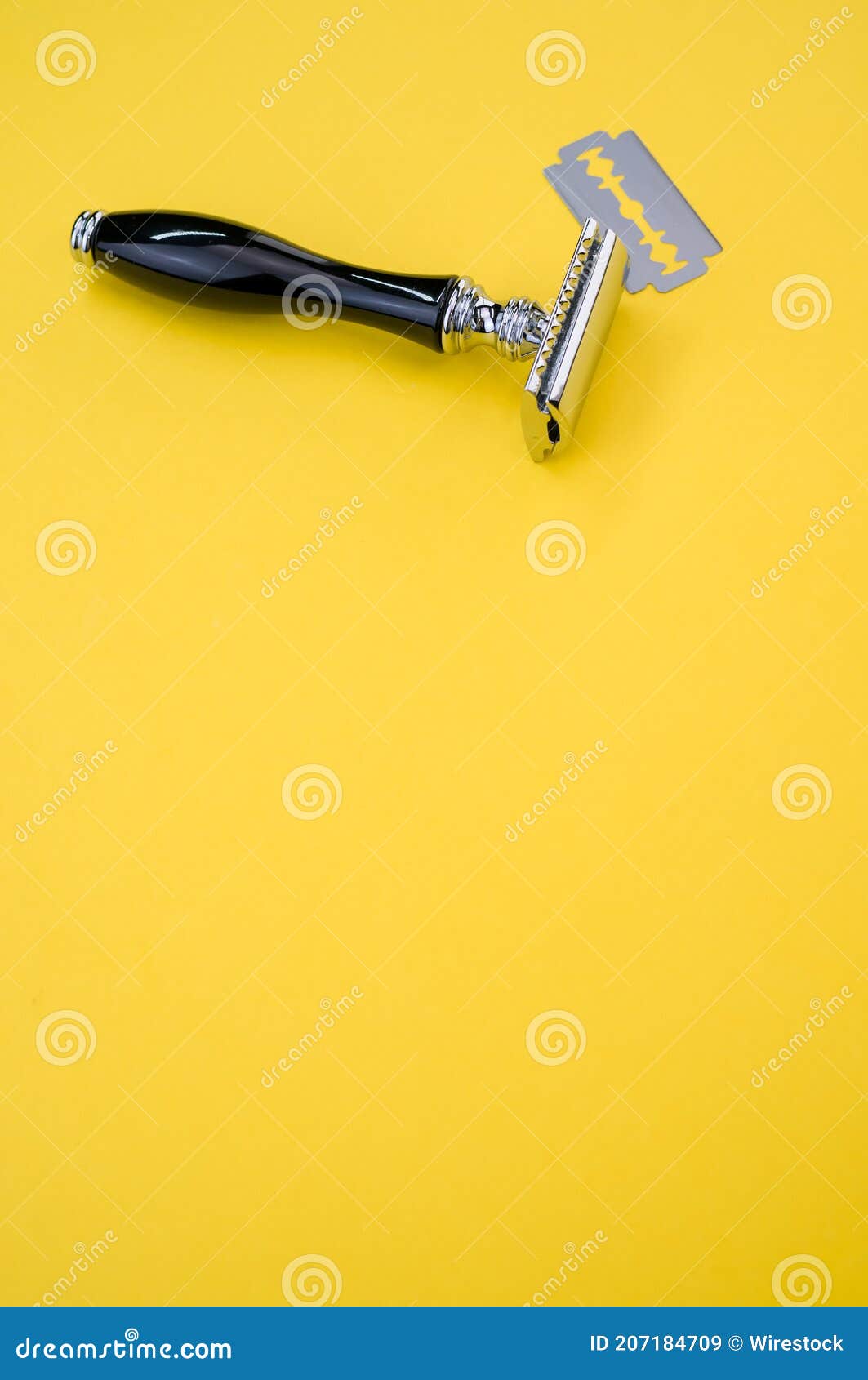 Vertof a Mechanical Razor and Blade Isolated on Yellow Background Stock ...