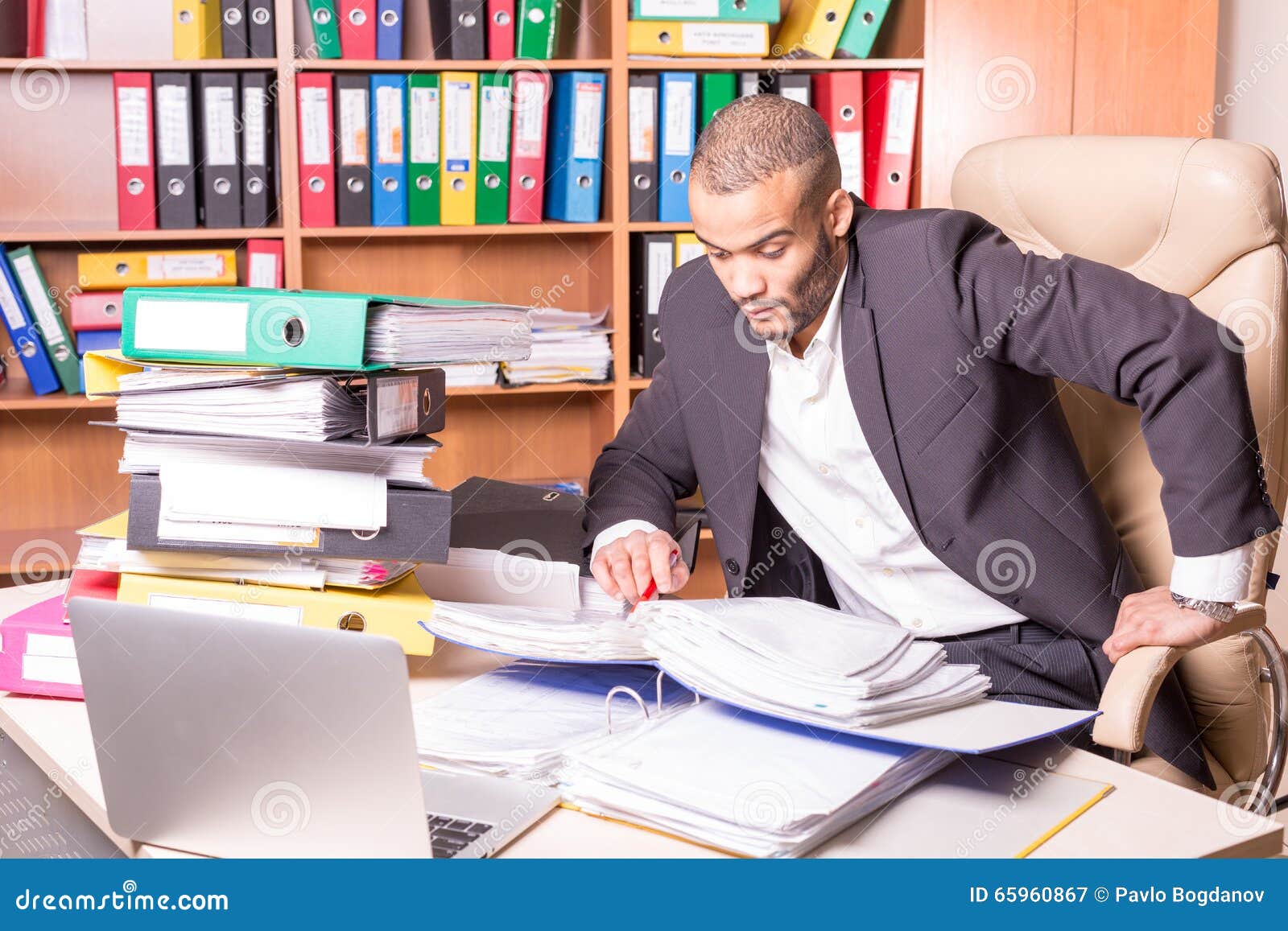Very busy man in office stock image. Image of document - 65960867