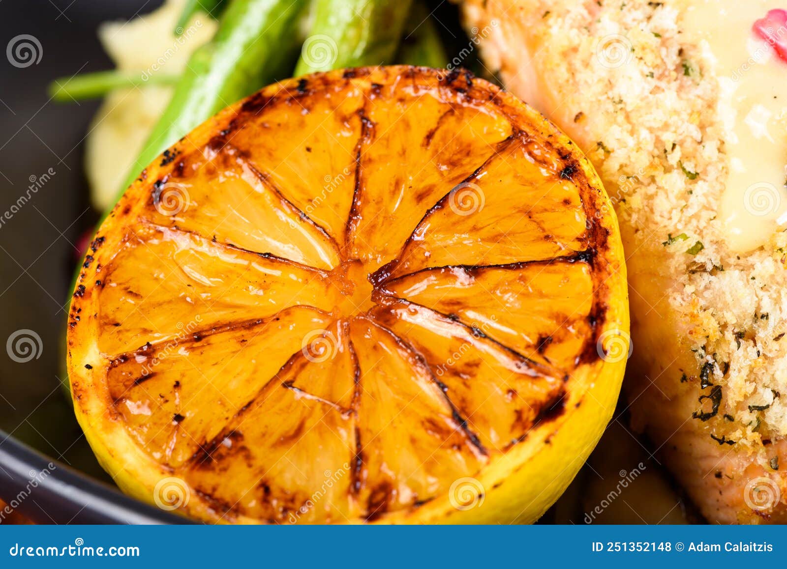 A Close View of a Slice of Grilled Lemon on a Plate of Food Stock Photo ...