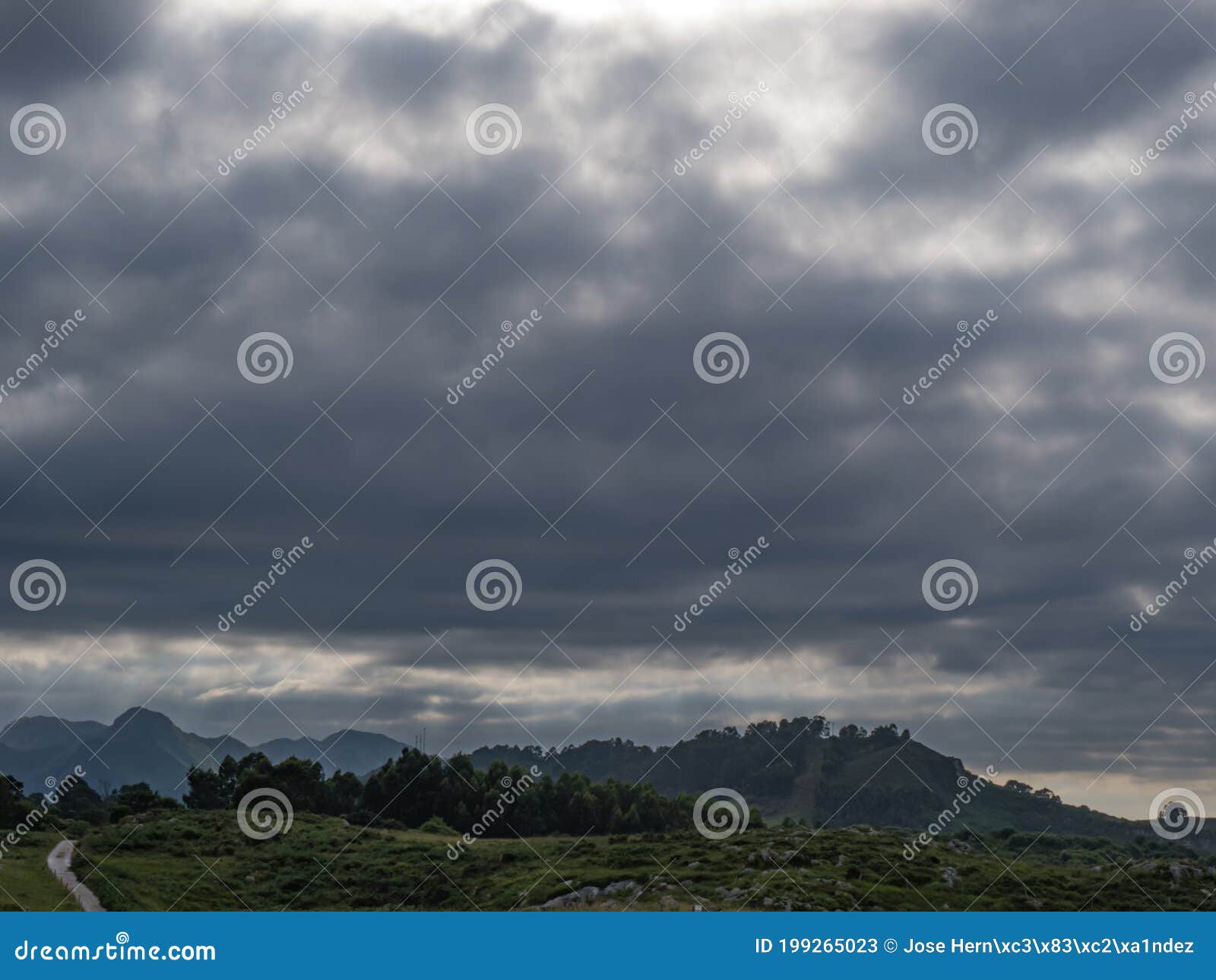 Very Cloudy Sky with Some Sun Rays through it Stock Image - Image of ...