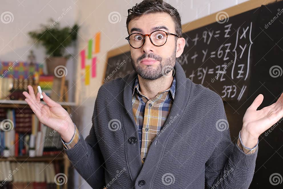 Very Confused Teacher in Classroom Stock Photo - Image of confused ...