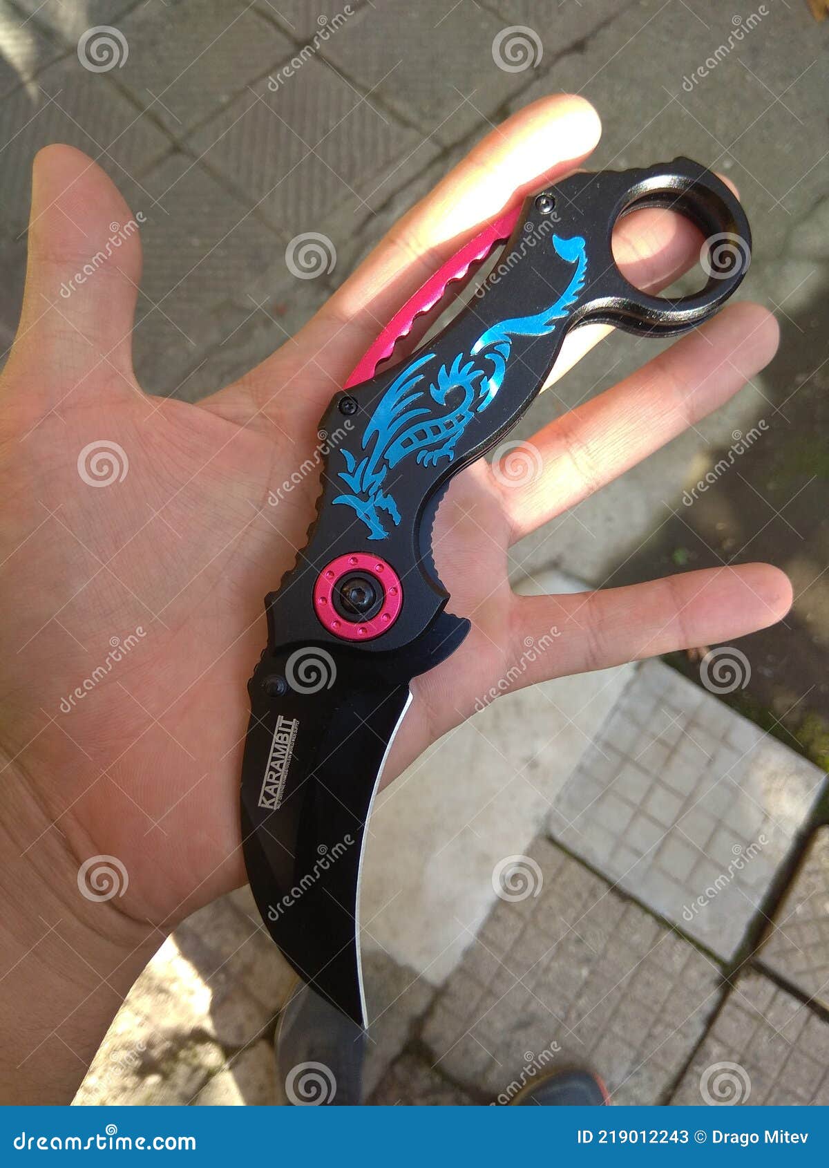 Very cool knife karambit editorial stock photo. Image of pink - 219012243