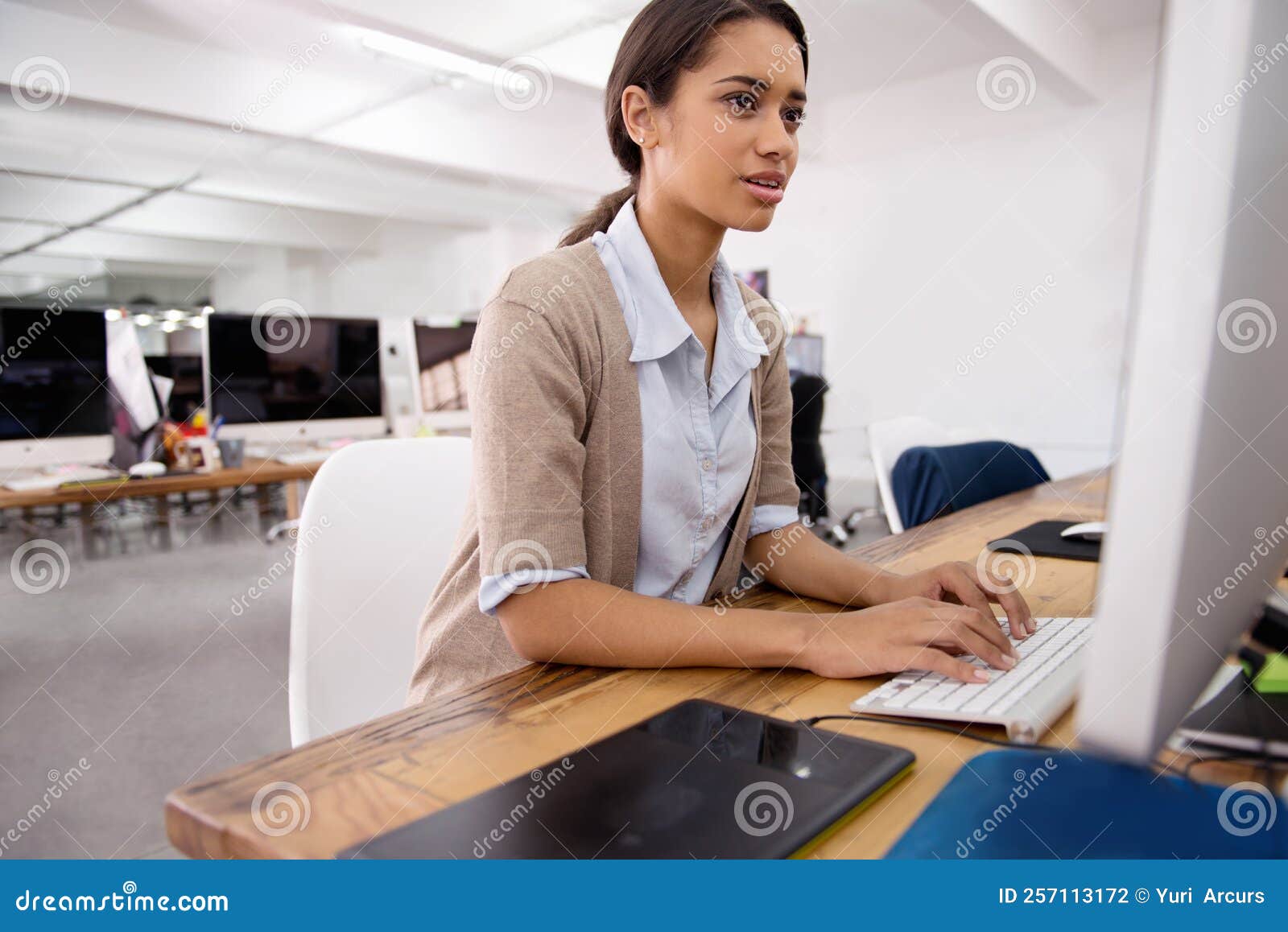 She is a Very Efficient Employee. an Attractive Young Woman Working on ...