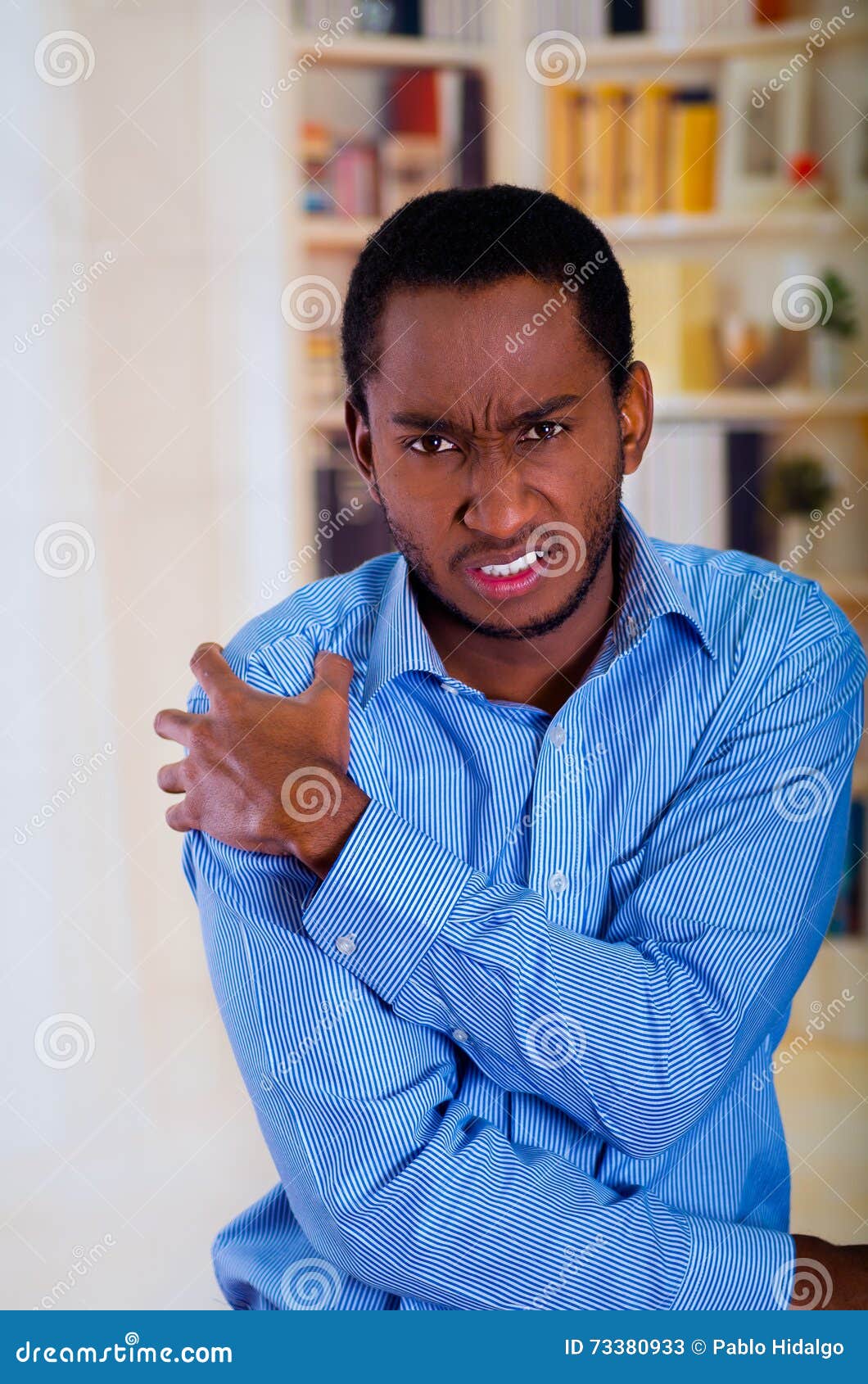 Very Hard and Strong Expression of Pain, Man Holding His Shoulder with ...