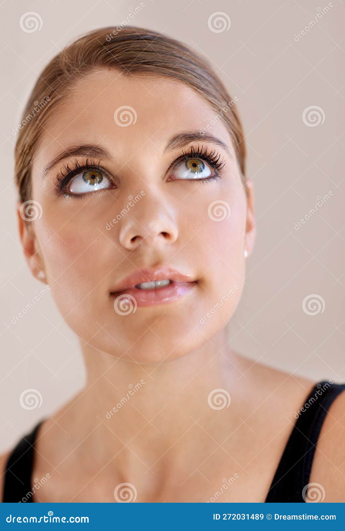 This is Very Interesting...Studio Shot of a Young Woman Looking Up at ...