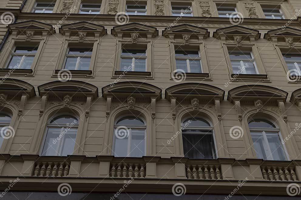 A Very Large Building Featuring Numerous Windows and Multiple Balconies ...