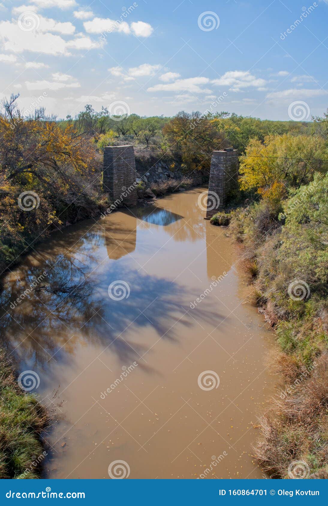 Very Muddy River and the Base of the Destroyed Old Bridge Stock Image ...
