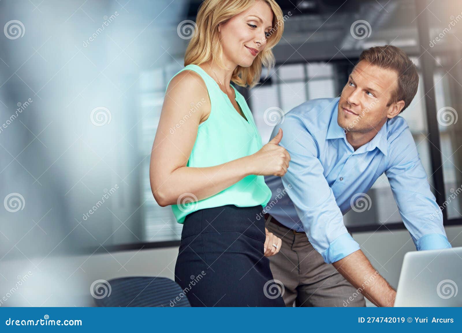 Very Nice Work. Two Colleagues Using a Laptop Together at Work. Stock ...