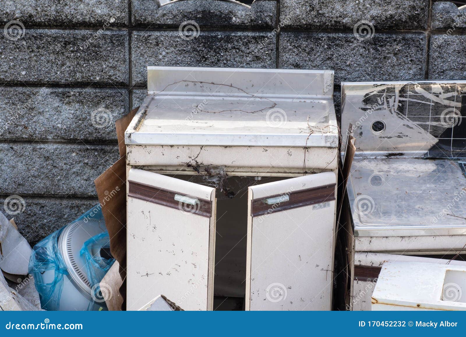 Old Kitchen Set with Cabinets Thrown Out at the Dump Site. Stock Photo ...