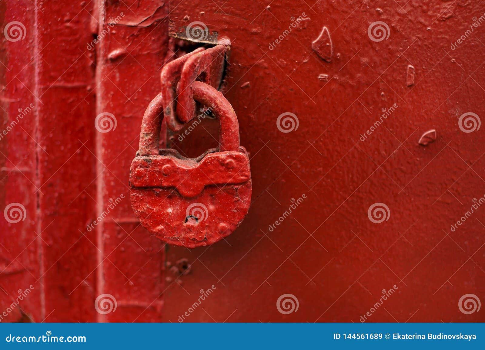 Red door with red lock stock image. Image of architecture - 144561689