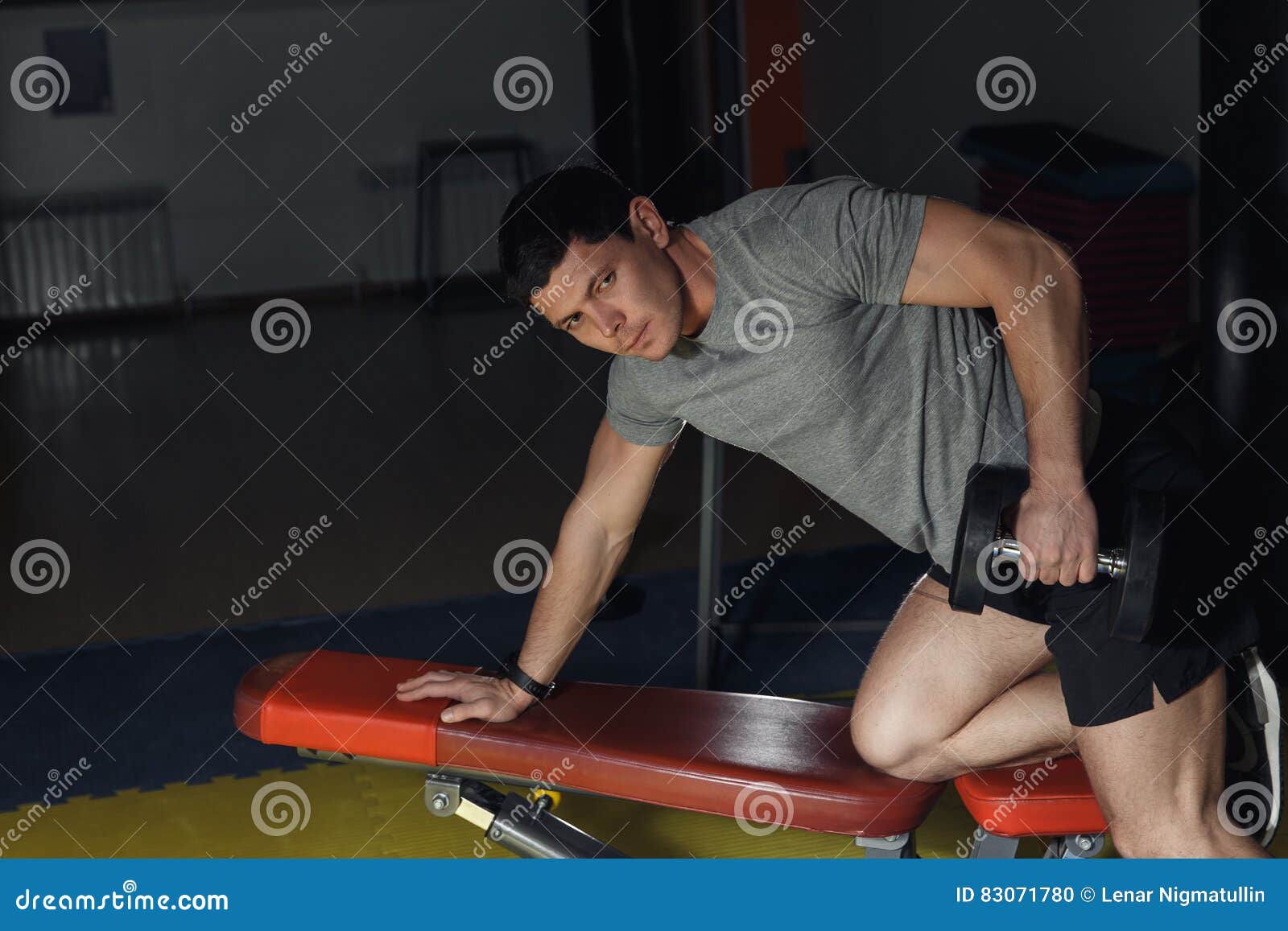 Very Power Athletic Guy , Execute Exercise with Dumbbells, on Broadest ...