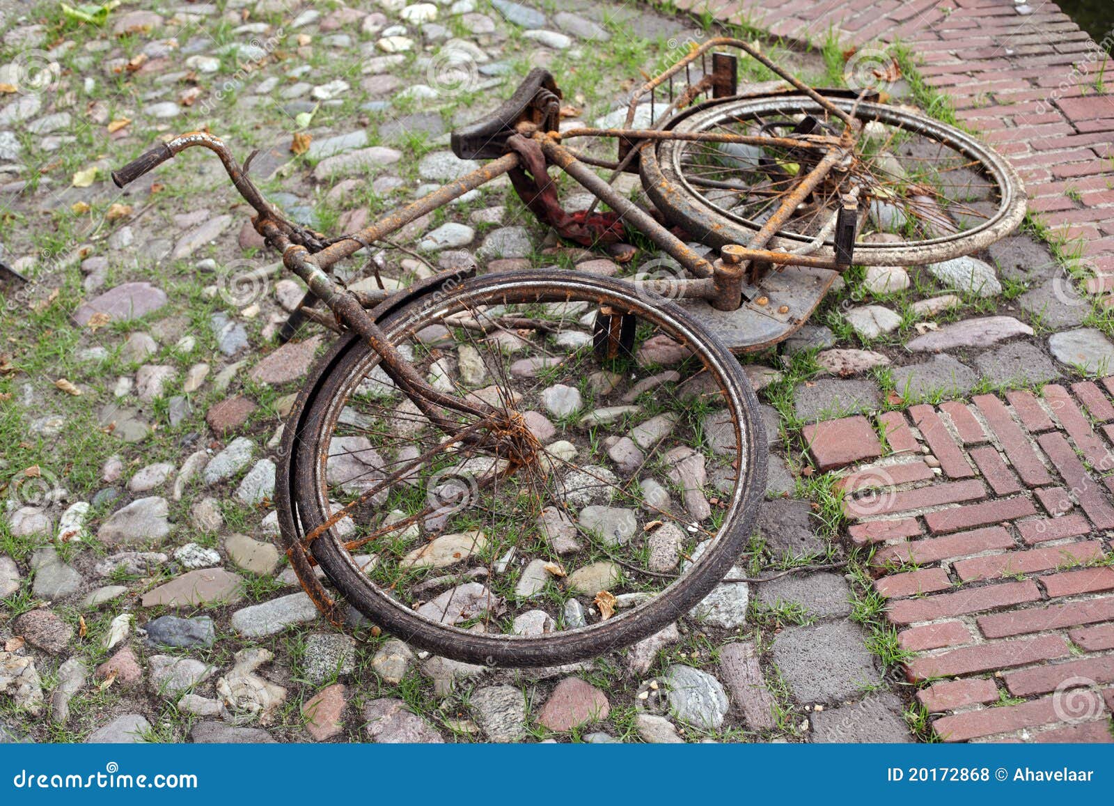 Very Rusty Bicycle Lying on Cobble-stones Stock Photo - Image of wheel ...