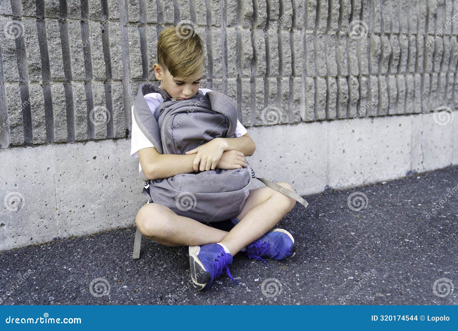 Very Sad Boy Bullying in School Playground. Stock Photo - Image of ...