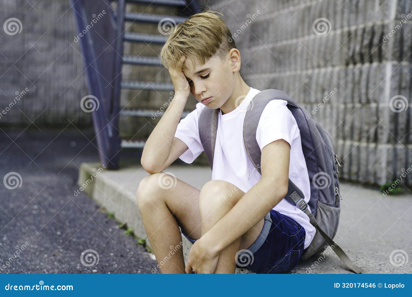 Very Sad Boy Bullying in School Playground. Stock Photo - Image of ...
