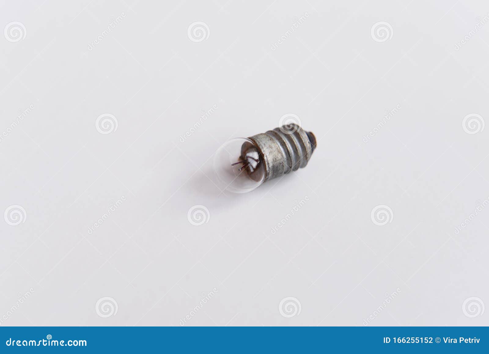 Very Small Light Bulb on a White Background Stock Photo - Image of ...