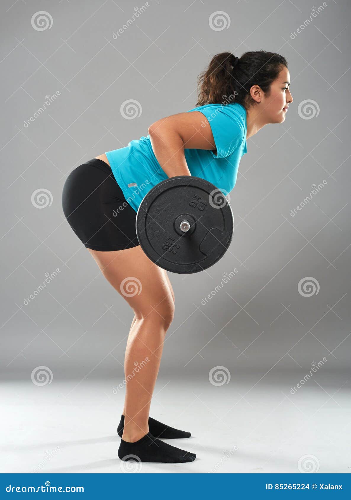 Strong Hispanic Woman Doing Barbell Rows Stock Photo - Image of adult ...