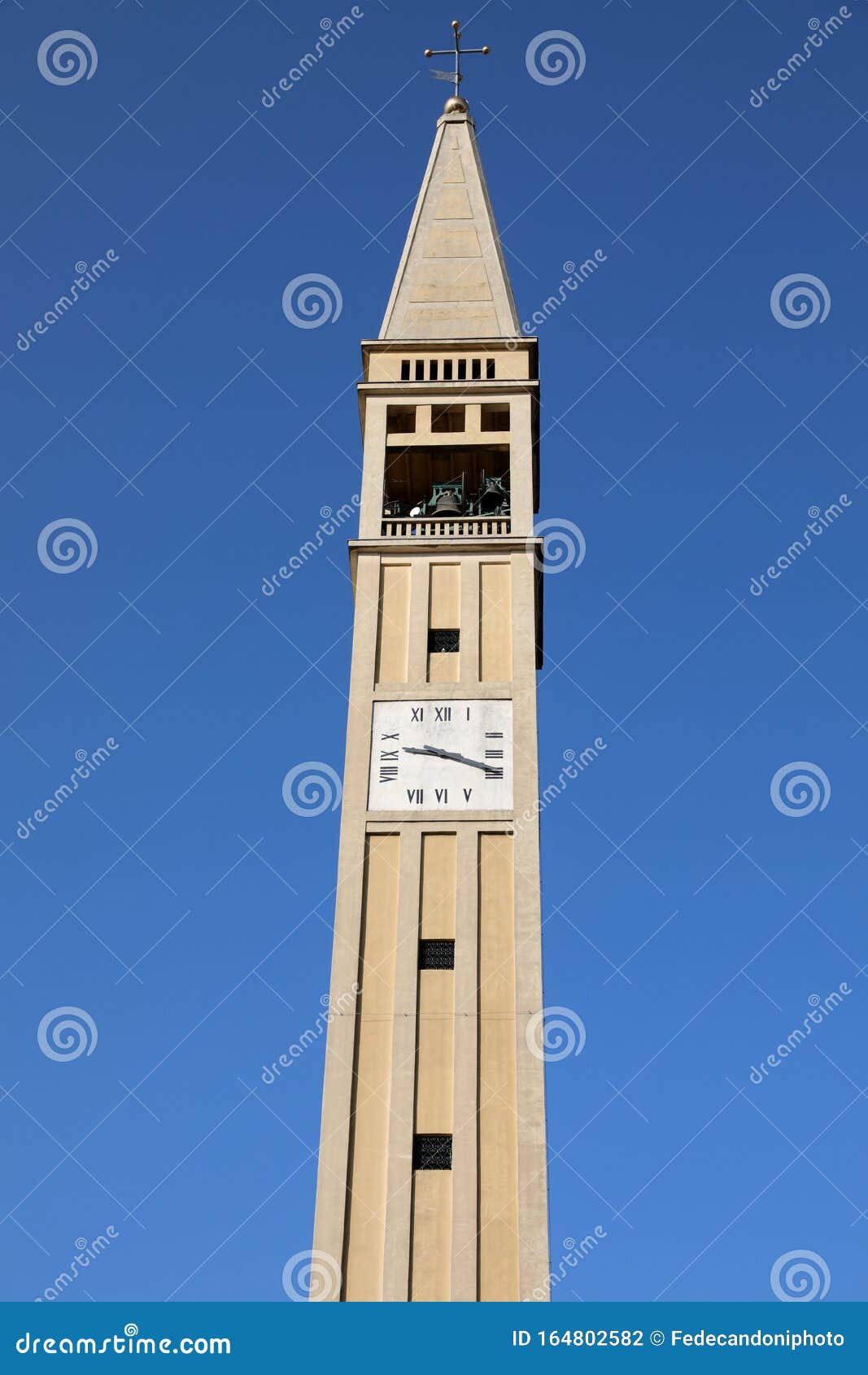 Very Tall Bell Tower with Pyramidal Spire with a Square Base and Stock ...