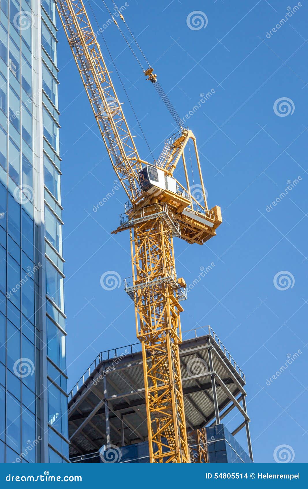 Very Tall Construction Crane Next To Skyscraper. Stock Photo - Image of ...