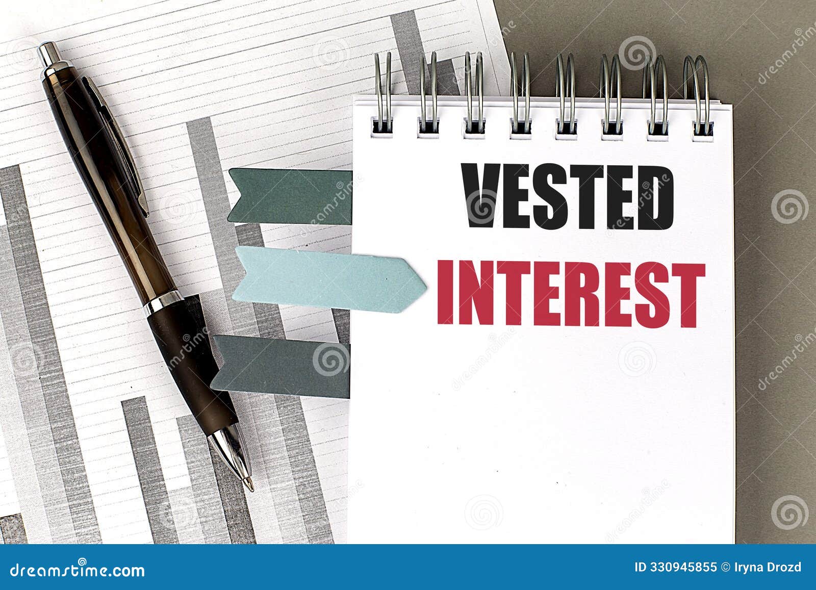 VESTED INTEREST Text on Notebook with Chart on Gray Background Stock ...