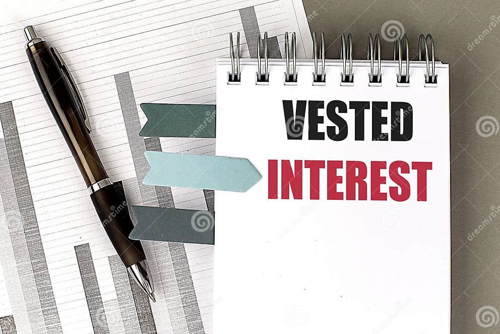 VESTED INTEREST Text on Notebook with Chart on Gray Background Stock ...