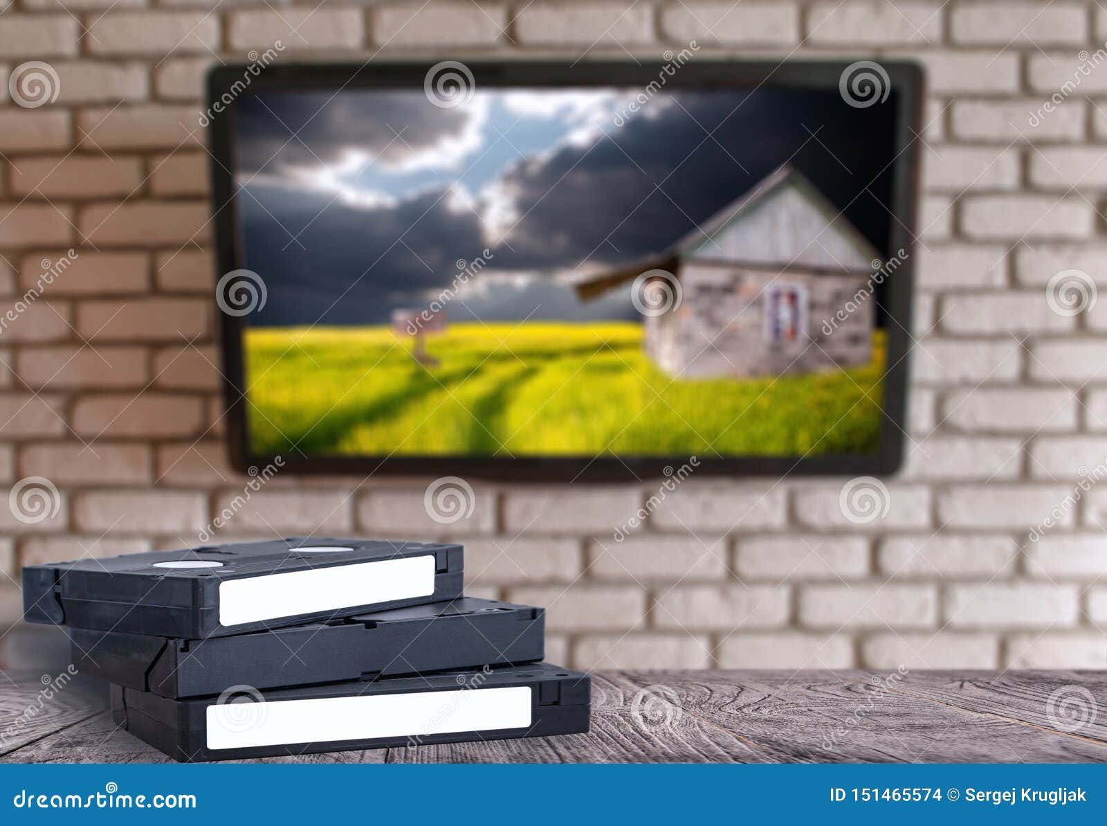 VHS Video Tapes on the Desk Brick Wall with a TV Stock Photo - Image of ...