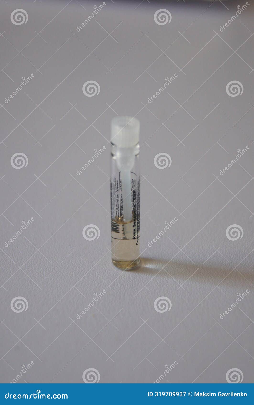 A Vial with Clear Liquid on Blurred Lab Background. Stock Image - Image ...