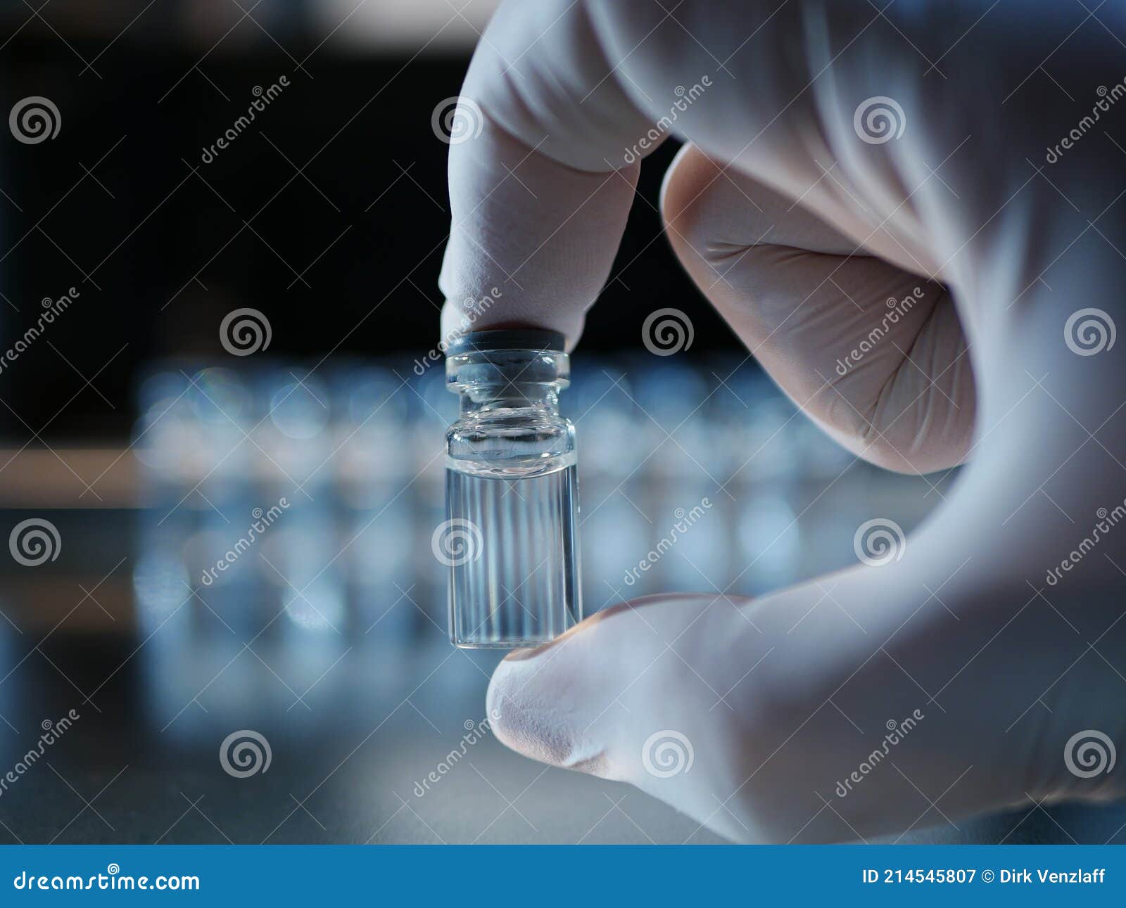 Two Fingers in a Glove Holding a Filled Vial Stock Image - Image of ...