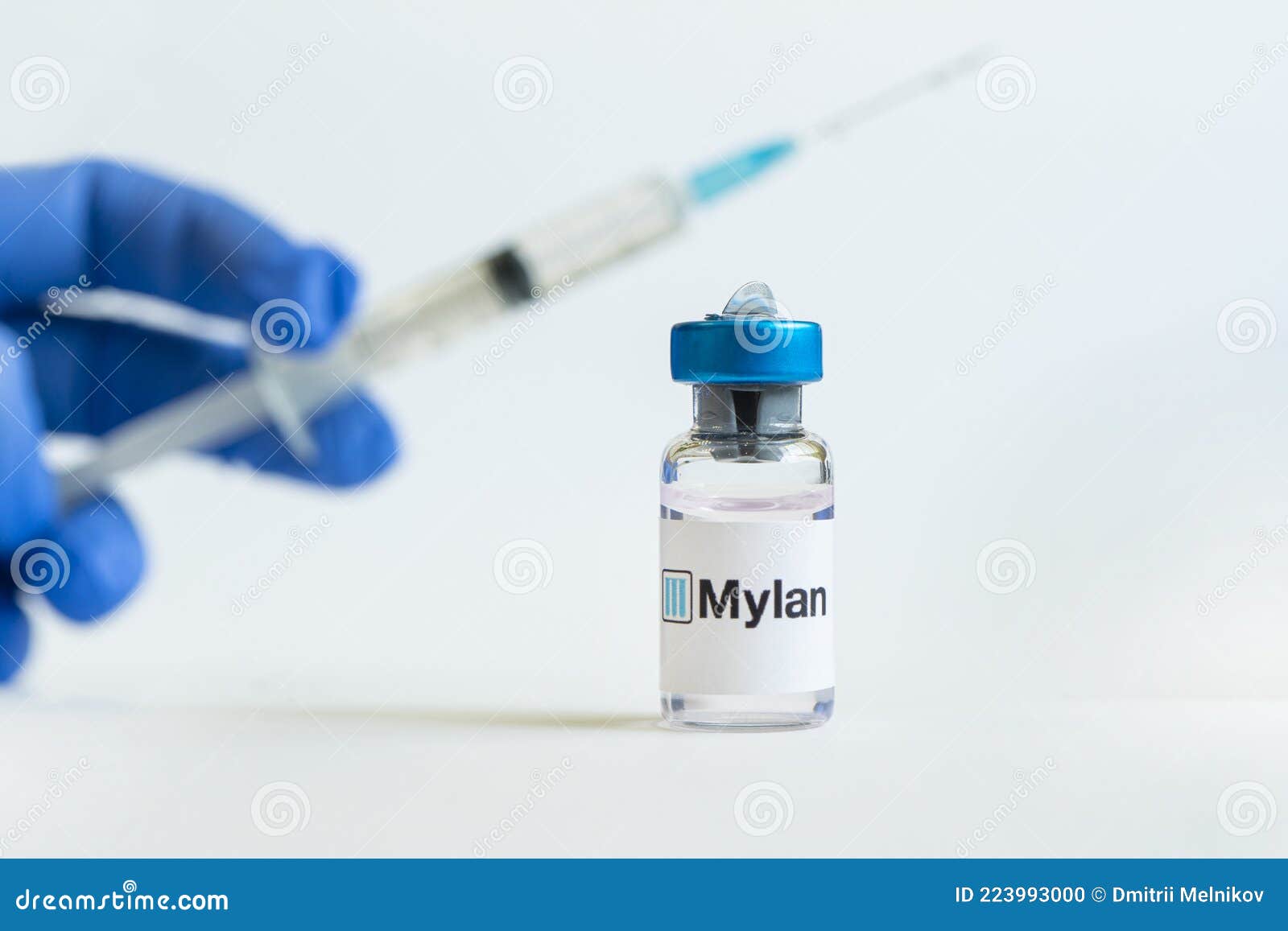 Vials of Liquid on a White Table and the Logo of a Large Pharmaceutical ...