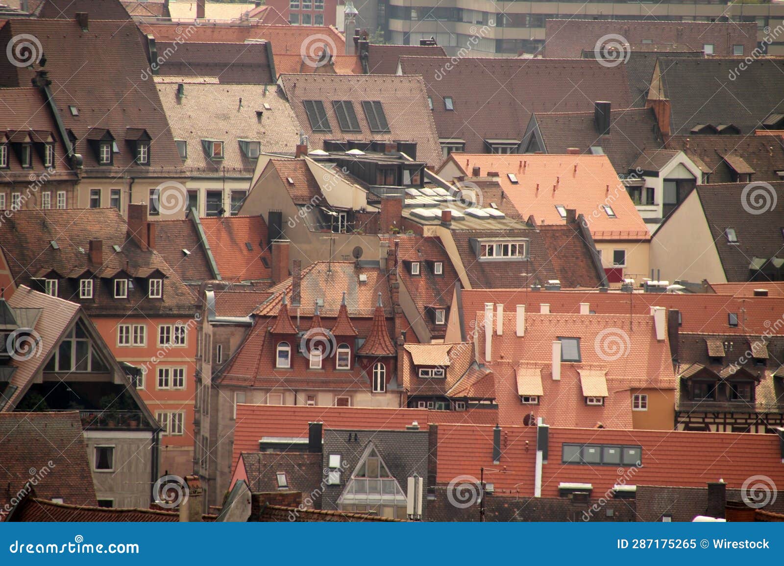Many Different Colored Rooftops with Many Building Styles in the ...