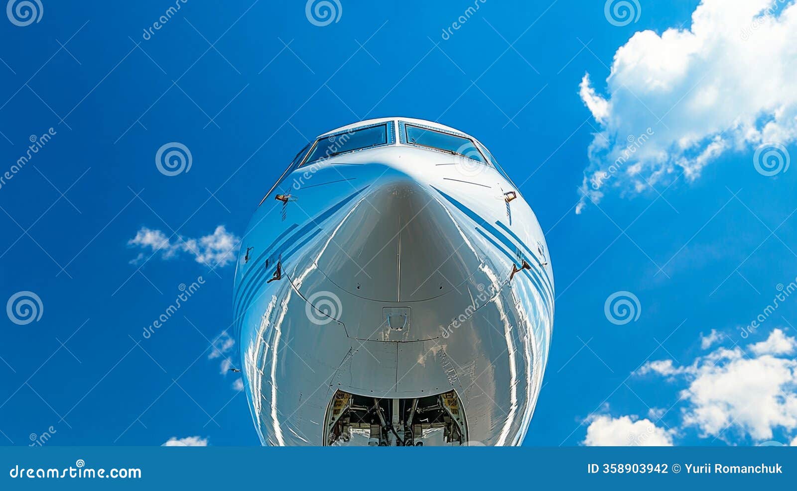 Vibrant Blue Sky Highlights the Streamlined Nose of a Jet Airplane ...
