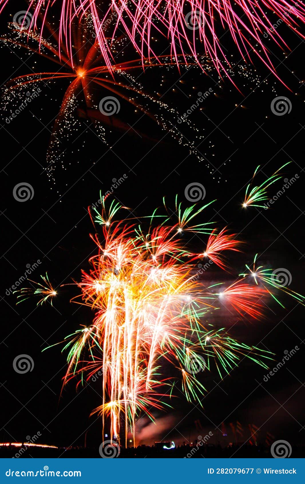 Vibrant Display of Multi-colored Fireworks Illuminates the Night Sky ...