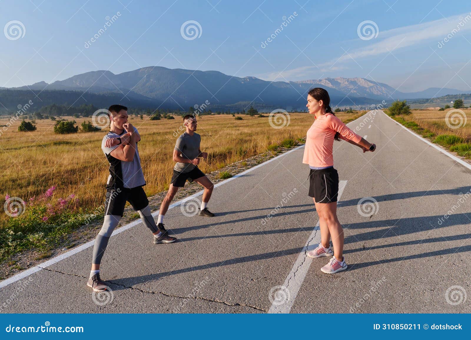 Diverse Athletes Prepare: Dynamic Group Warms Up for Morning Run. Stock ...