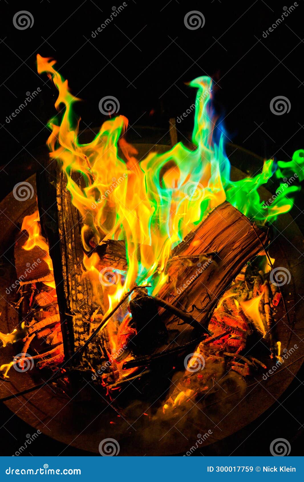 Vibrant Fire Pit Display with Green and Blue Flames in Outdoor Setting ...