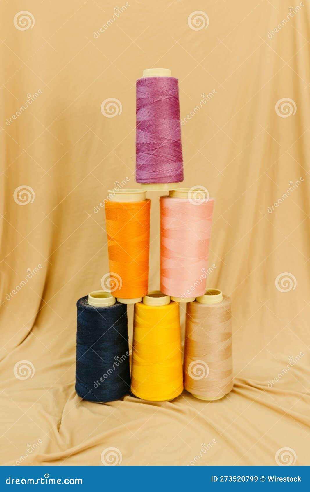 Vibrant Image of a Selection of Multi-colored Thread Spools Stacked ...