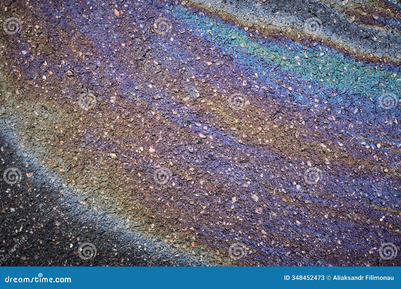 Vibrant Oil Patch Drawing Attention on the Asphalt Pavement. Stock ...