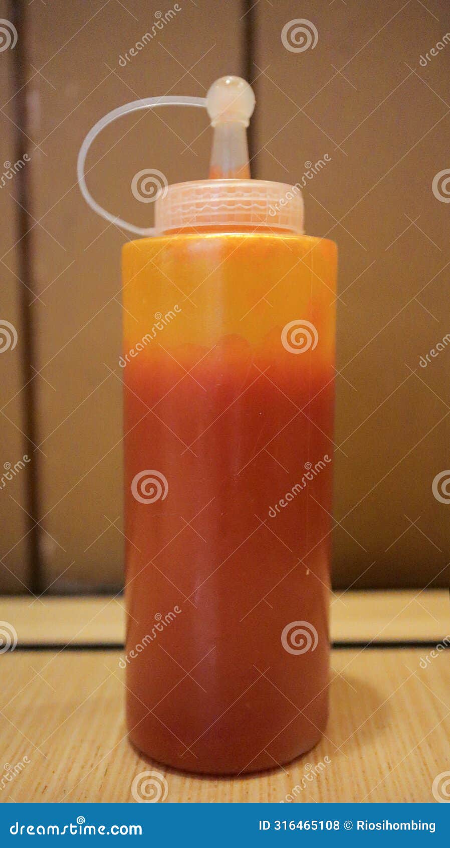 Vibrant Red Chilli Sauce in Clear Container for Food Topping Stock ...