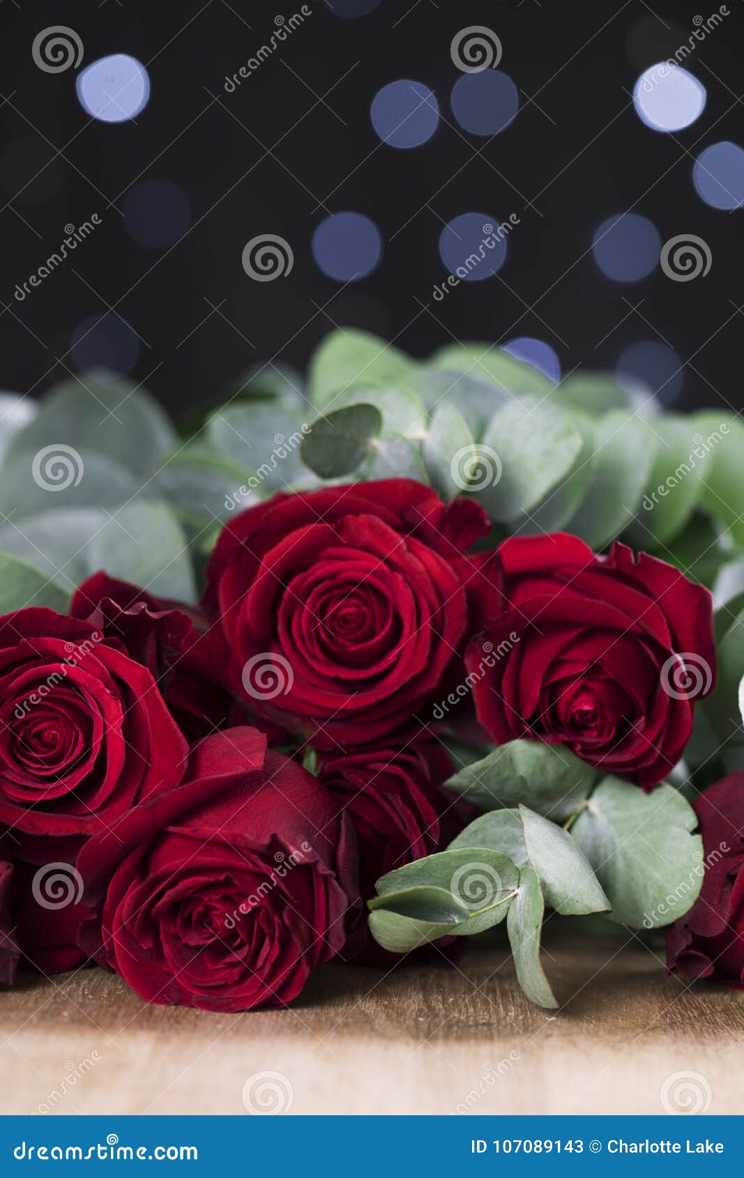 Vibrant Red Roses Vertical stock image. Image of leaves - 107089143