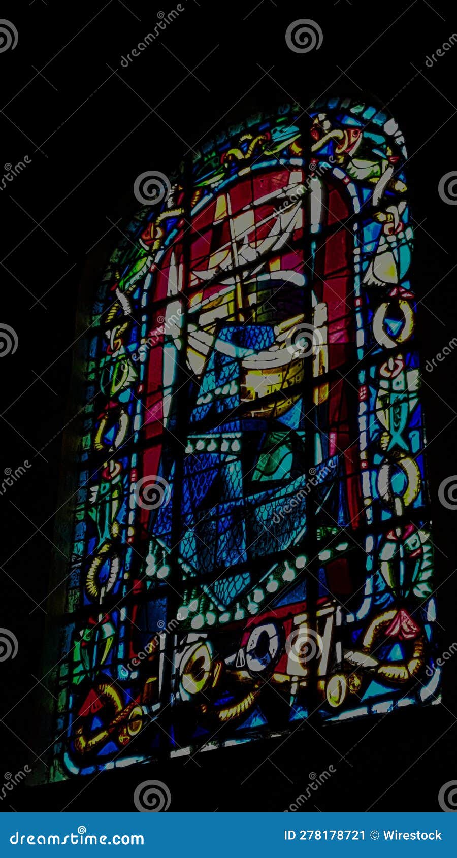 Vibrant Stained Glass Window Illuminated Against the Backdrop of a Dark ...