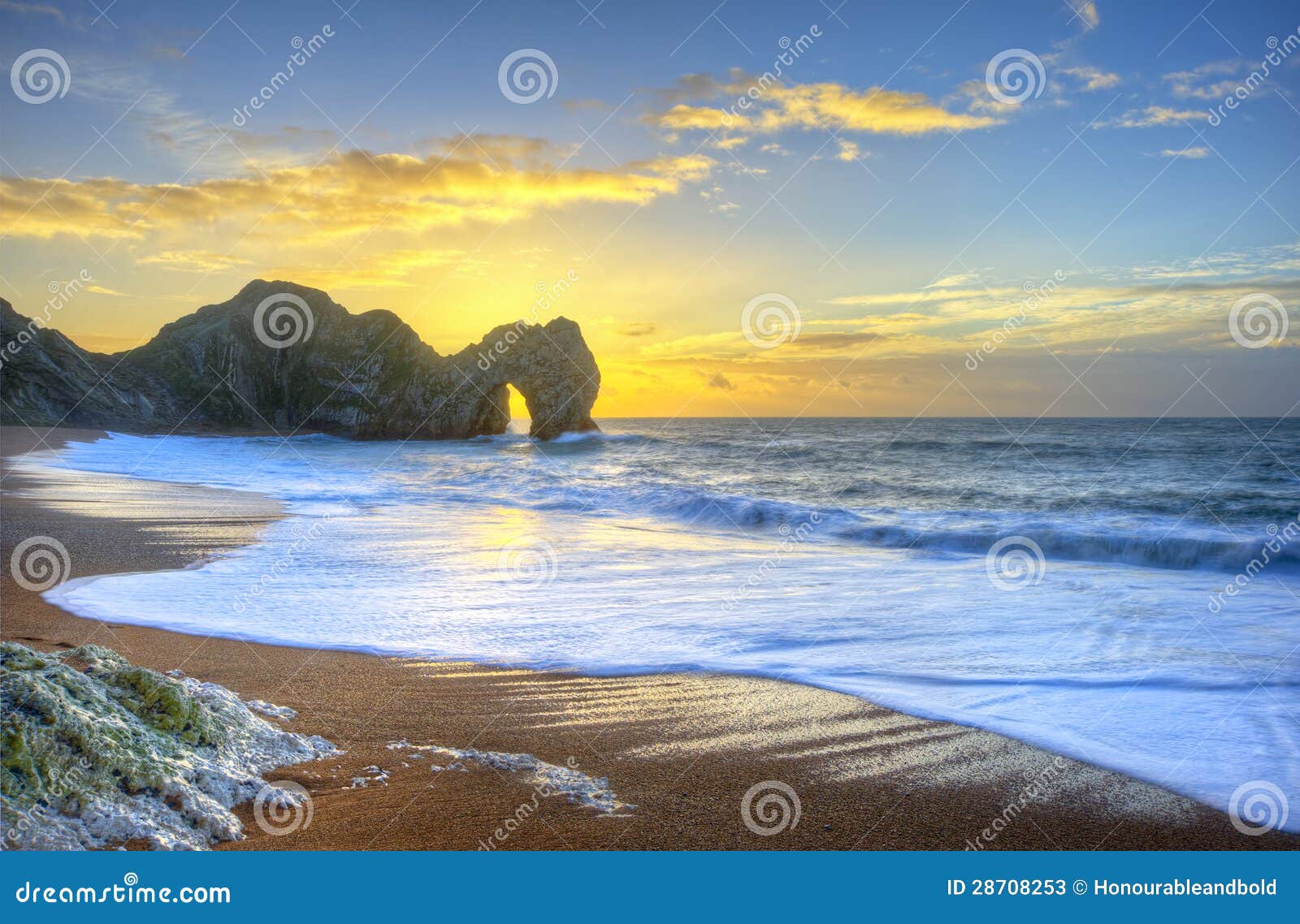 Vibrant Sunrise Over Ocean with Rock Stack in Foreground Stock Image ...