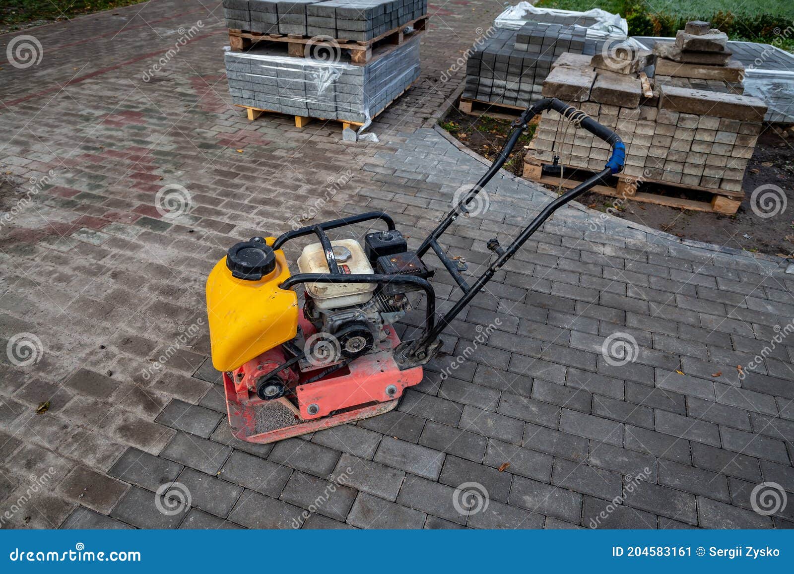 Vibrating Plate Compactor Machine at a Construction Site. Equipment for ...