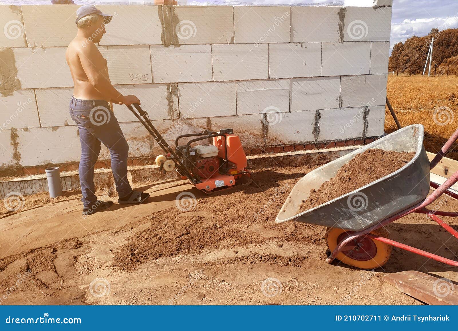 Vibrating Plate in Use, the Worker with the Help of a Vibrating Plate ...