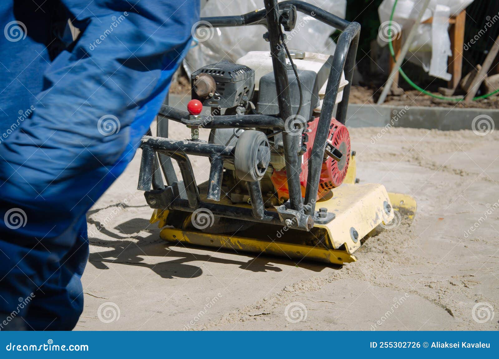 Vibratory Plate Construction Site. Construction Workers Installing and ...