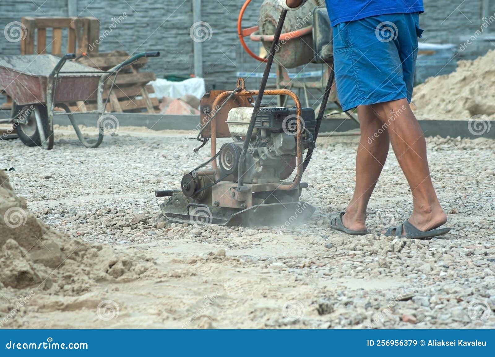 Vibratory Plate Construction Site. Construction Workers Installing and ...