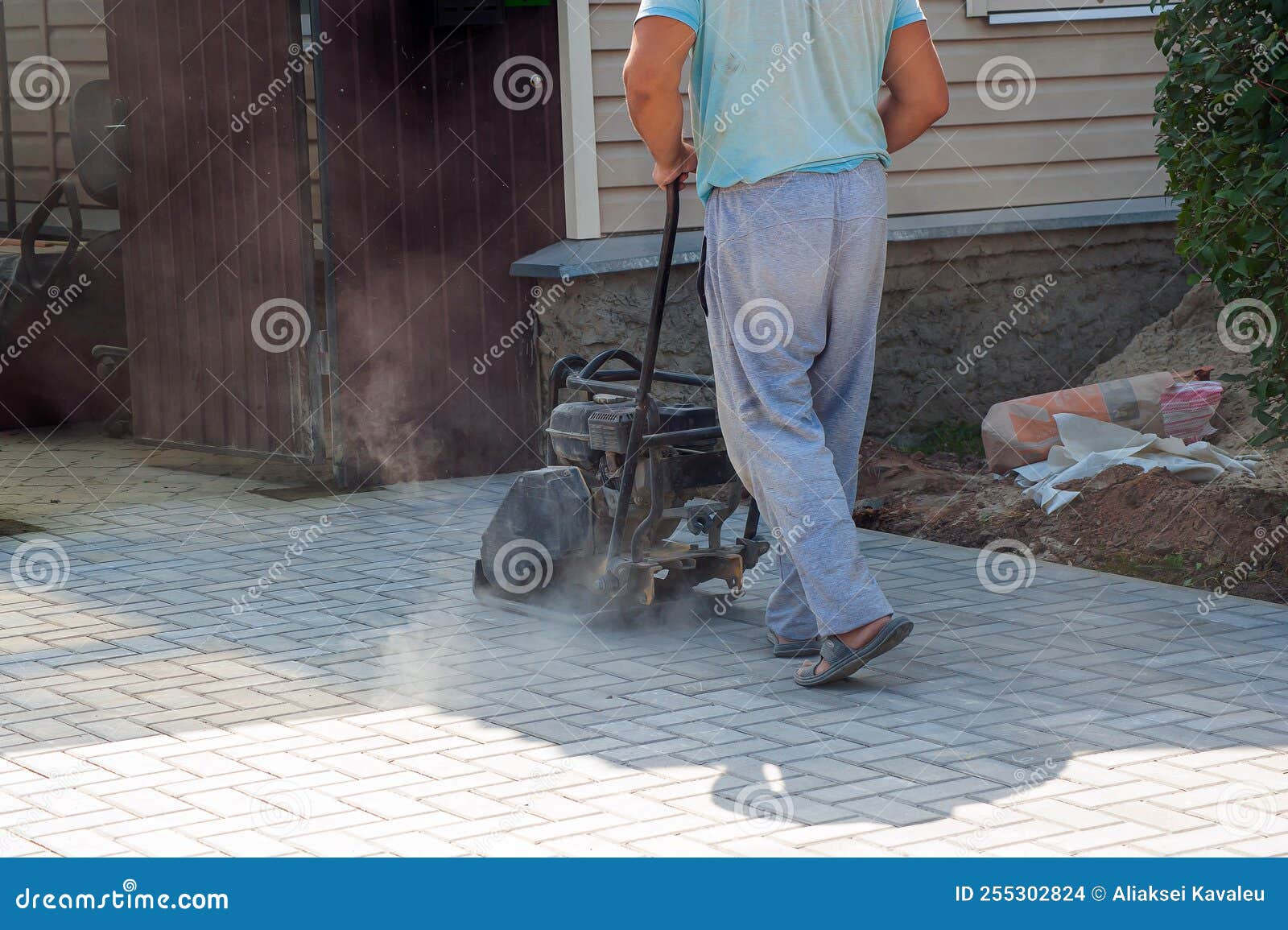Vibratory Plate Construction Site. Construction Workers Installing and ...